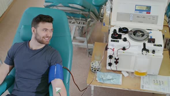 Men at Blood Drawing Station, Stock Footage | VideoHive
