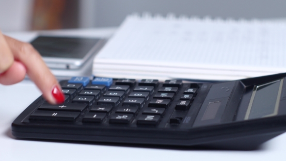 Office Worker Doing The Math On a Calculator. , Stock Footage | VideoHive