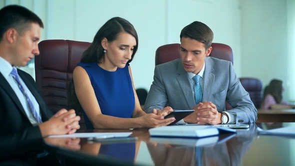 Professional Workers And Boss Meeting And Discussing Topics With Tablet ...