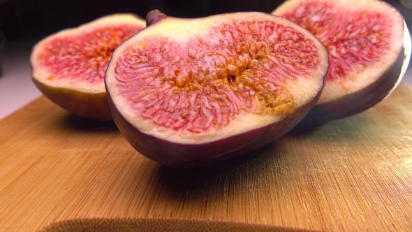 Beautiful Female Hand Taking The Half Of Fig. Pan Shot, Stock Footage