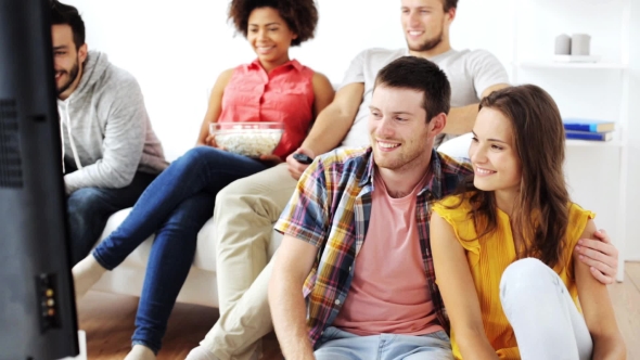 Happy Friends With Popcorn Watching Tv At Home, Stock Footage | VideoHive
