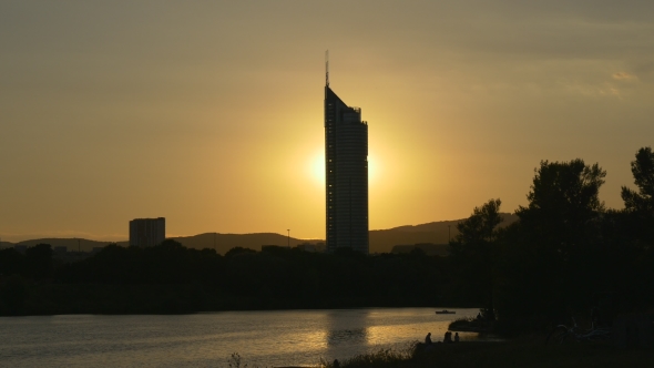 High-rise Building Glows As The Sun Goes Behind It, Stock Footage ...