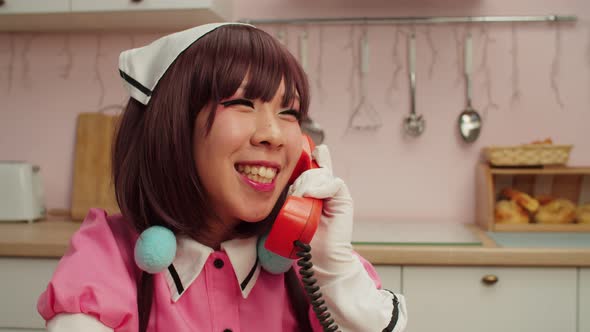 Portrait of Joyful Charming Asian Female Cosplayer Talking on Landline ...