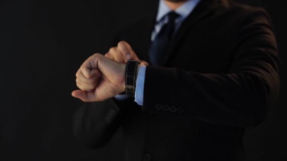 Businessman Pointing To Smart Watch On His Hand, Stock Footage | VideoHive