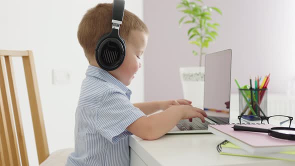 Baby Learning Online Using Laptop Headphones Child Typing Computer Home ...