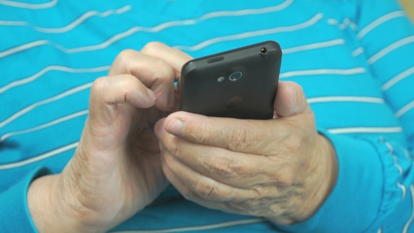 Old Woman Using Smartphone At Home, Stock Footage | VideoHive