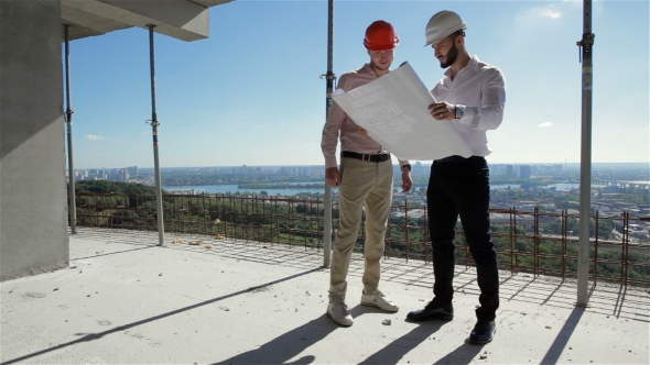 Two Builders Meet At The Building Under Construction, Stock Footage