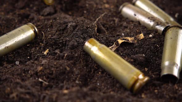 Bullet casings fall to the ground. Slow motion., Stock Footage | VideoHive