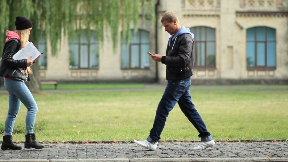 Man With Phone Bumping Into Woman On The Street, Stock Footage | VideoHive