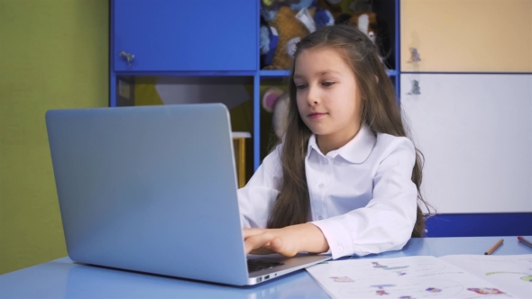 SchoolGirl Studying At The Library Doing After Lessons Homework With ...