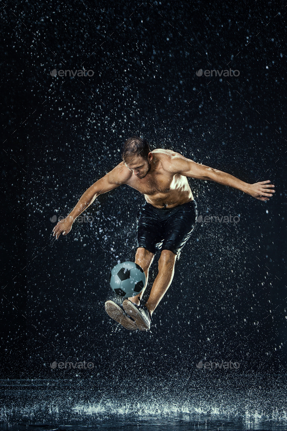 Water drops around football player Stock Photo by master1305 | PhotoDune