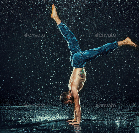 The male break dancer in water. Stock Photo by master1305 | PhotoDune