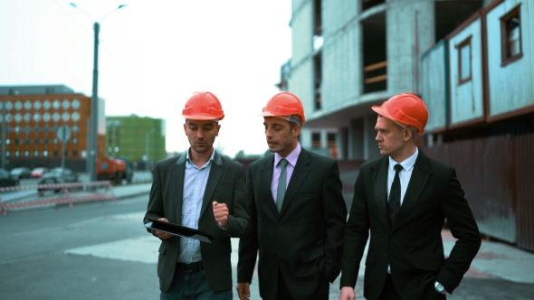 Three Architects Discuss Newly Constructed Building, Stock Footage