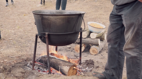 Cooking Soup With Lamb In a Cauldron., Stock Footage | VideoHive