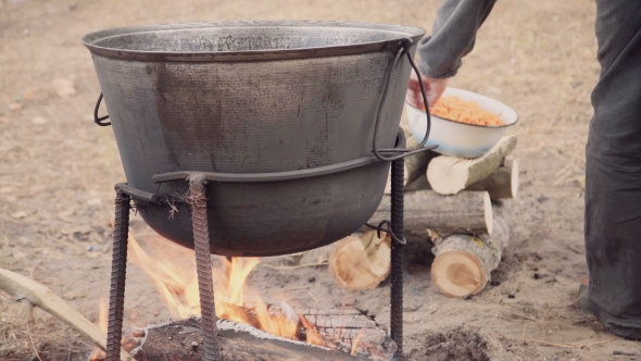 Cooking Soup With Lamb In a Cauldron., Stock Footage | VideoHive