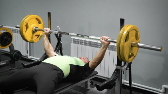 Lying Man Do Exercise With Barbell, Stock Footage | VideoHive
