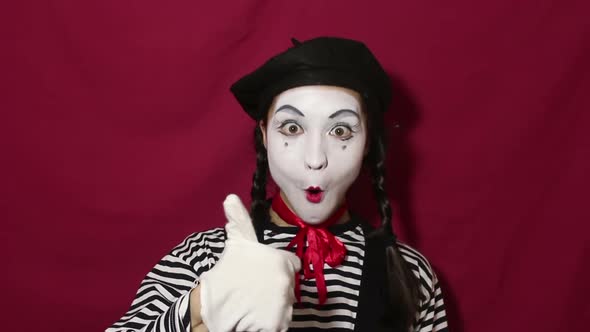Beautiful Girl Mime Smiles, Shows Thumb Up and Nods Approvingly While ...