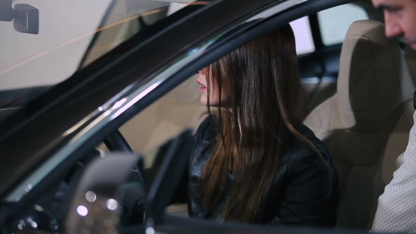 Woman Testing The Electric Car Inside Of Car, Stock Footage | VideoHive