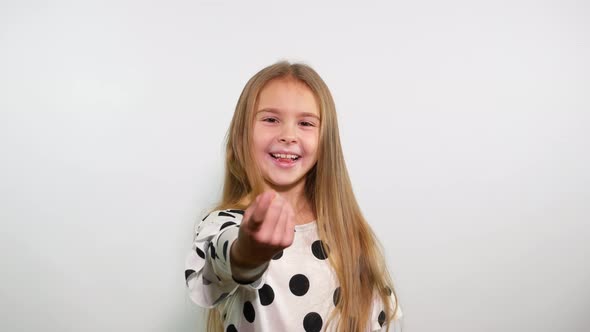 Playful Girl Waving to Come to Her Using One Finger as Gesture, Stock ...