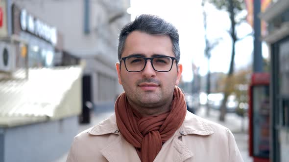 A Man of Eastern Appearance a Poet and Artist with Glasses Looks at the ...