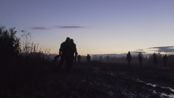 Soldiers Are On The Muddy Field At Sunset. Military Night., Stock Footage