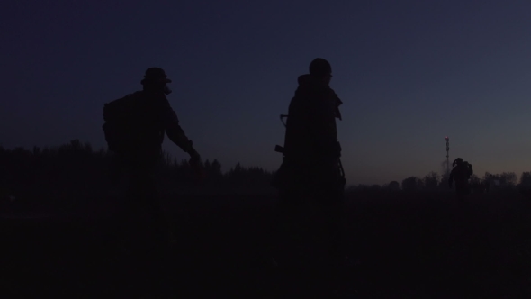 Soldiers Are On The Muddy Field At Sunset. Military Night., Stock Footage