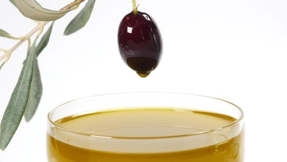 A Drop Of Olive Oil Falling From One Black Olive, Stock Footage | VideoHive