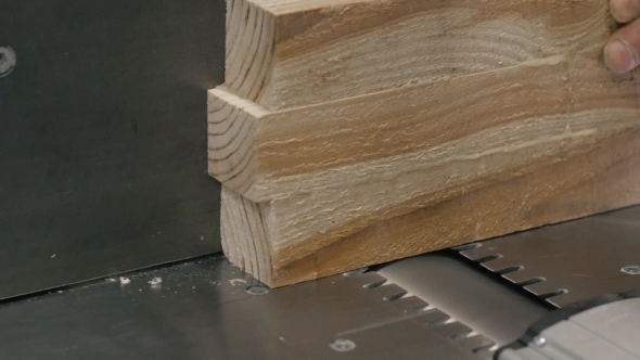 Man Using a Table Saw To Cut Wood, Grinding On Modern Furniture Factory ...