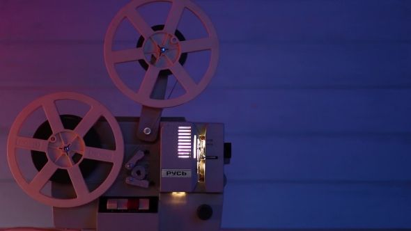 Film Projector Over Wooden Table With Red-blue Light, With Light Beam ...