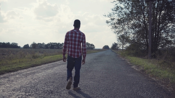 Stylish Guy Walking On Road In Rural., Stock Footage | VideoHive