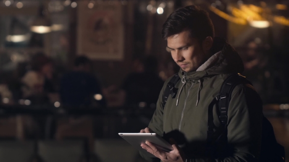 Handsome Young Man With Tablet Pc Navigating In The Night Streets ...