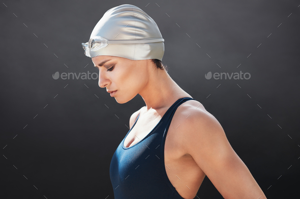 Fit young female swimmer Stock Photo by jacoblund | PhotoDune