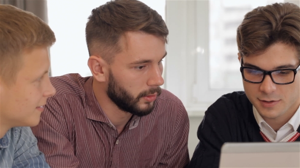 Three Men Look At The Laptop, Stock Footage | VideoHive