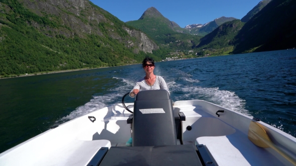 Woman Driving a Motor Boat, Stock Footage | VideoHive
