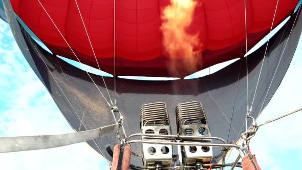 Large Gas Burner Inflates Air Balloon With Hot Air To Rise Above The ...
