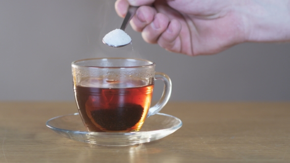 Man Puts Sugar Into a Cup, Stock Footage | VideoHive