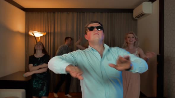 Cheerful Nerd Guy with Glasses Dancing and Partying., Stock Footage