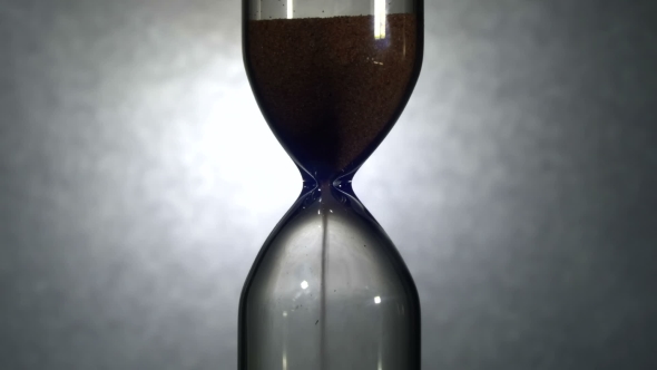 Hourglass On a White Background, The Sand Falls Inside, Stock Footage