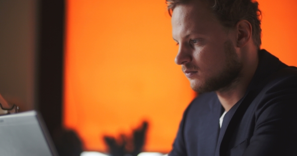 Young Man Reading His Laptop In The Dark, Stock Footage | VideoHive