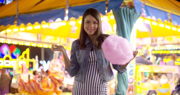Young Woman Having Fun at a Colorful Fairground, Stock Footage | VideoHive