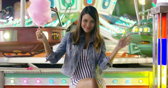 Young Woman Having Fun at a Colorful Fairground, Stock Footage | VideoHive