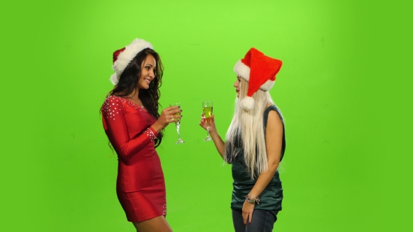 Two Santa Girl Drinking a Champagne New Year, Green Screen, Stock Footage