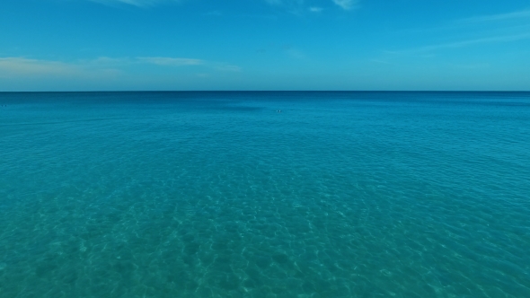 Aerial: Flying Over the Beautiful Blue Water in the Sea., Stock Footage