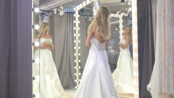 The Bride Fitting Wedding Dress in the Boutique, Stock Footage | VideoHive