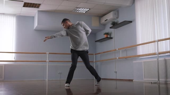 Young Guy Makes Beautiful Dance Moves in a Dance Studio, Stock Footage