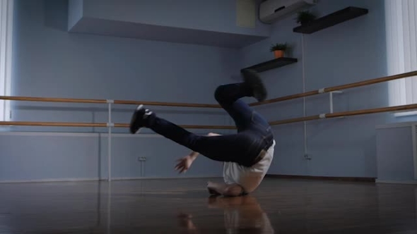 Professional Breakdancer Performs Complex Dance Exercise on the Floor ...