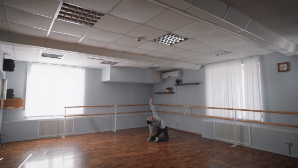 Acrobatic Dance at the Dance Studio. Dancer Performs Trick in the Dance ...