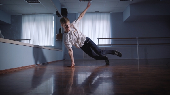 Dancer in White Shirt and Jeans Showing Modern Breakdancing in ...