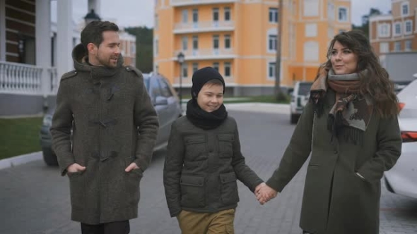The Man in the Gray Coat, His Wife and Child in the Cortyard, Stock Footage