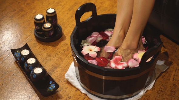 Young Woman in Foot-bath in Oriental Herb Water for Body Detox, Stock ...